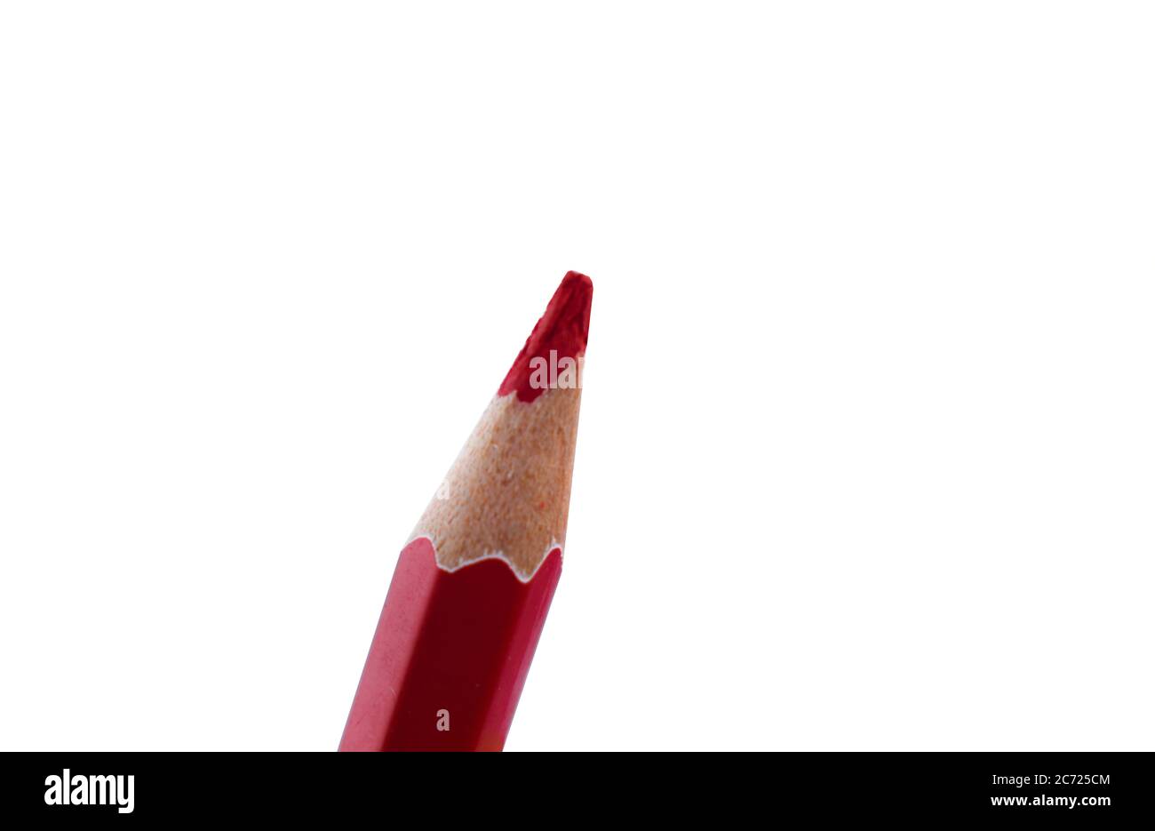 One single sharp red color wood pencil placed in front of white paper ...