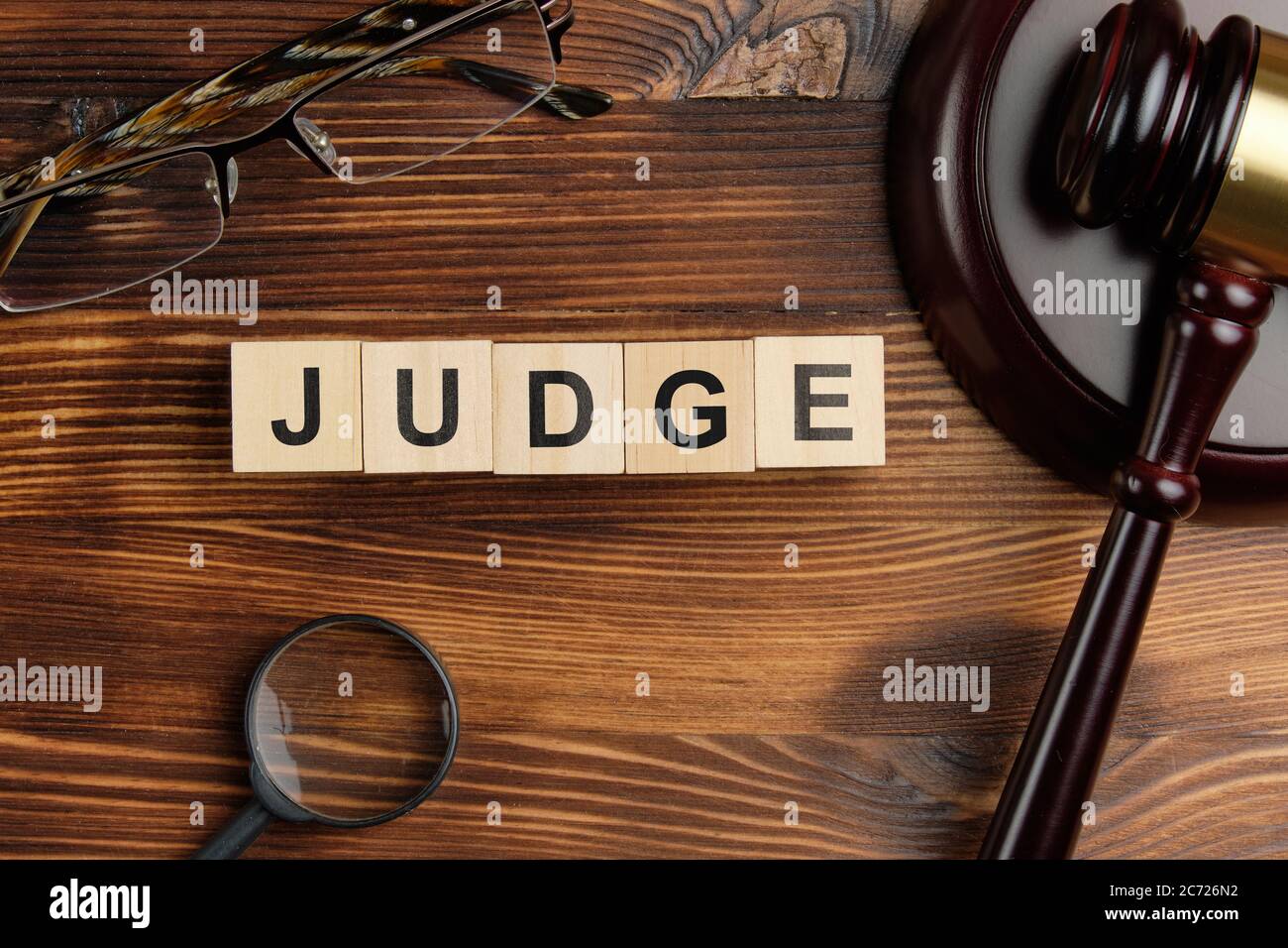 The concept of the judge in wooden cubes Stock Photo - Alamy