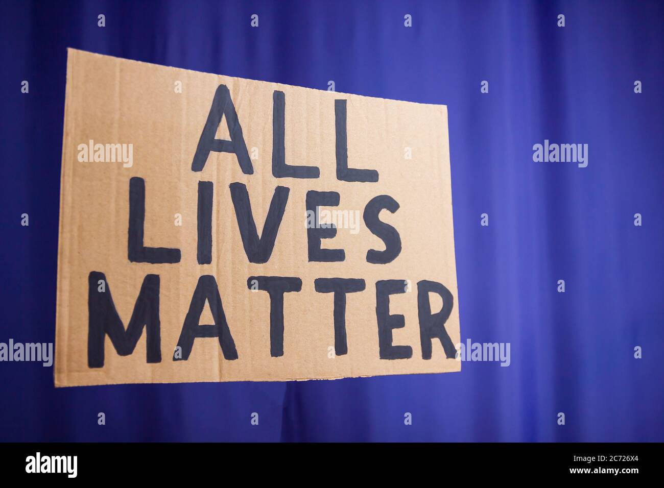 ALL LIVES MATTER on a blue blurred background. Anti racism concept ...