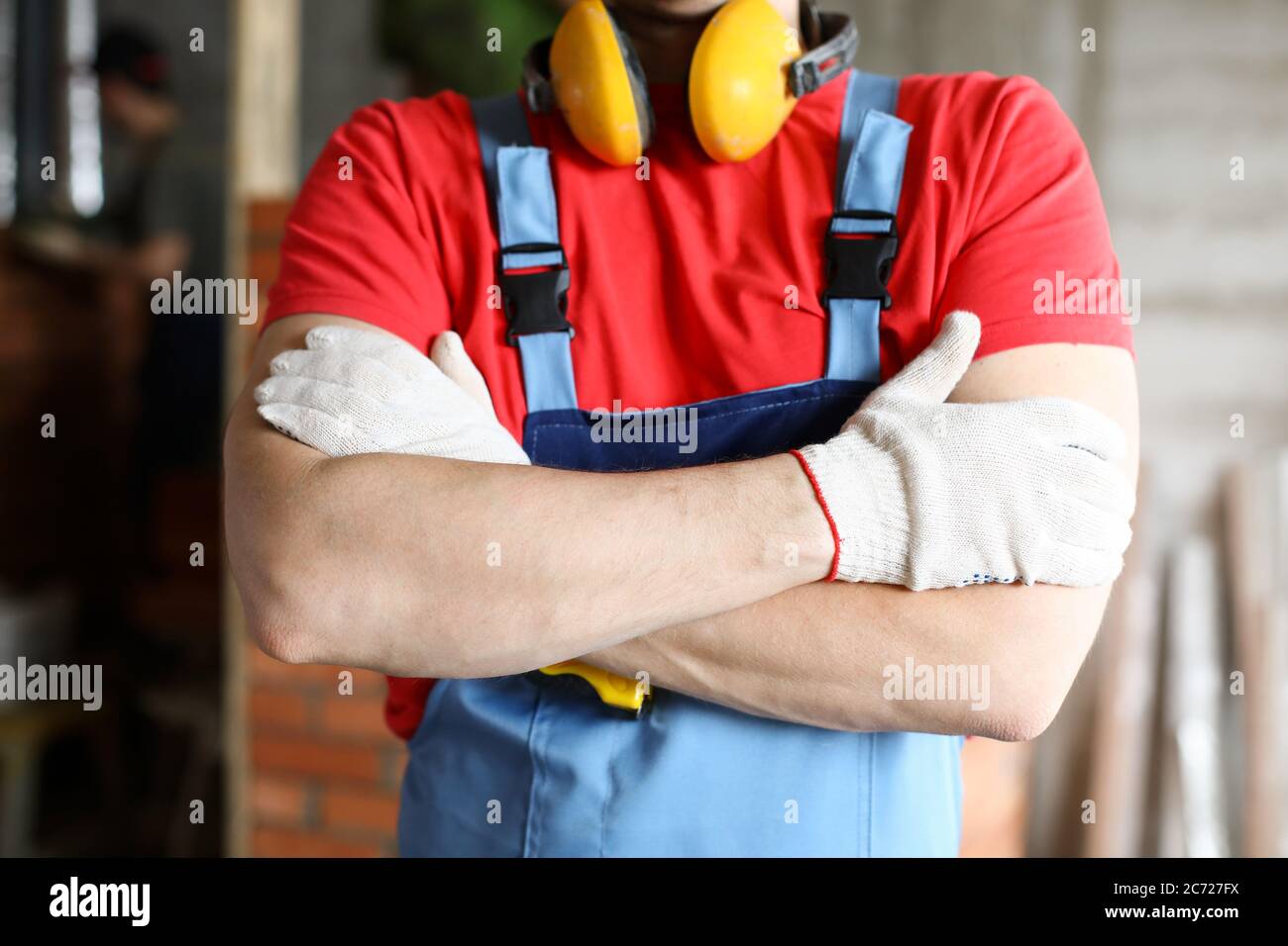 Man in building uniform Stock Photo - Alamy