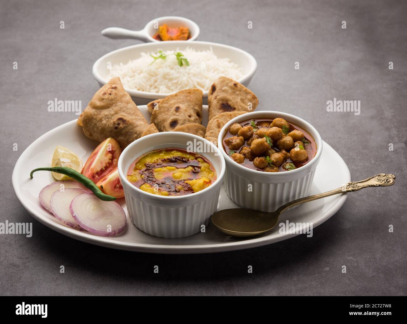 Indian Food Platter or Vegetarian Thali includes Dal Fry, Rice, Chapati ...