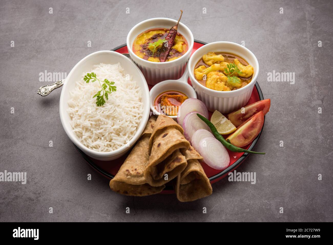 Indian Food Platter or Vegetarian Thali includes Dal Fry, Rice, Chapati ...