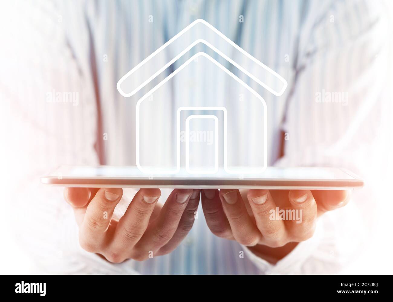 Hands holding tablet Stock Photo - Alamy