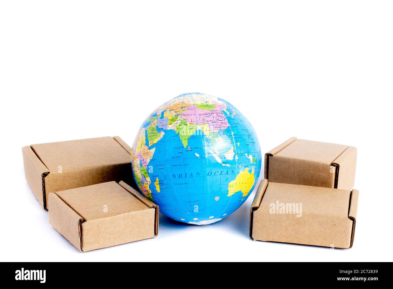 Earth globe is surrounded by boxes isolated on white background. Global ...