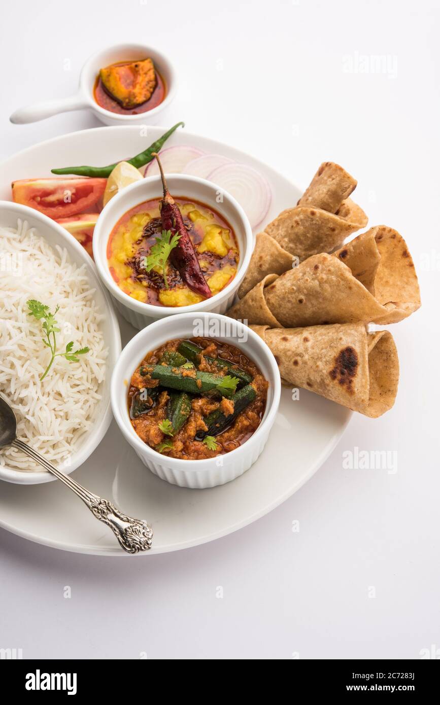 Indian Food Platter or Vegetarian Thali includes Dal Fry, Rice, Chapati ...