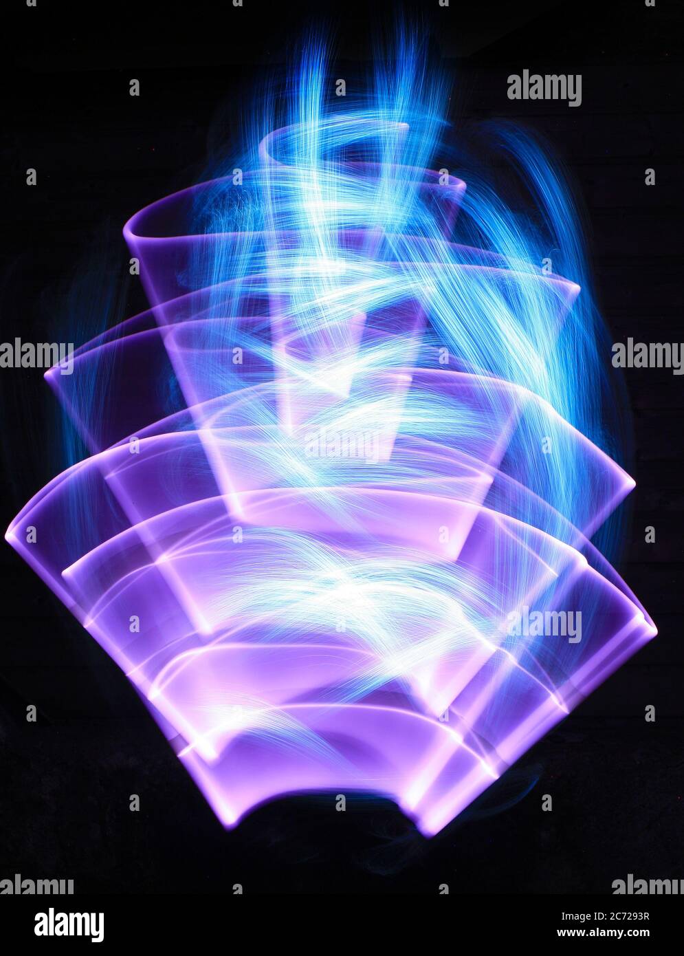 Curved and flame shape made of led light and white streaks made to ...
