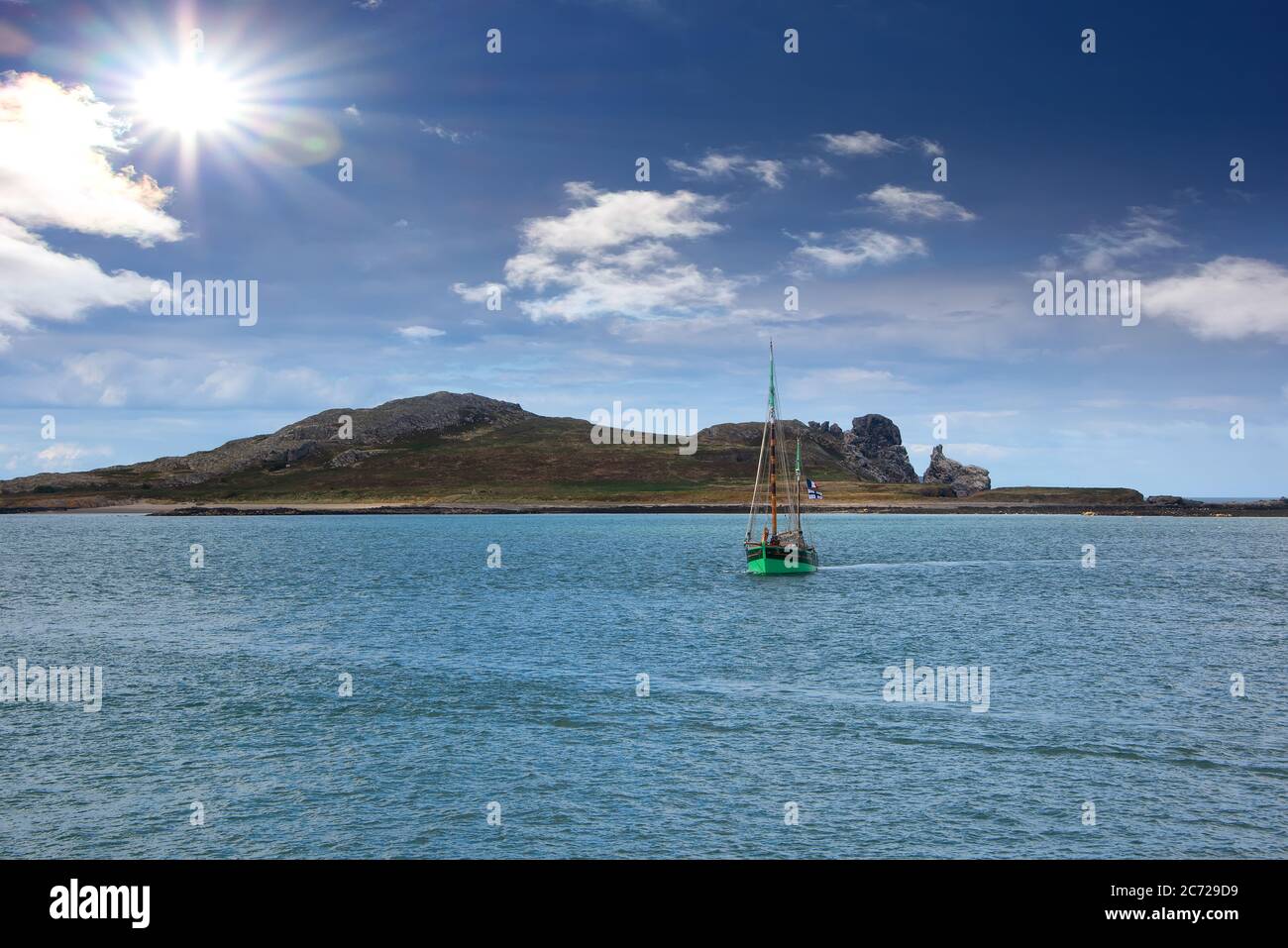 Large boat sailing on the Howth Peninsula near the fishing village of ...