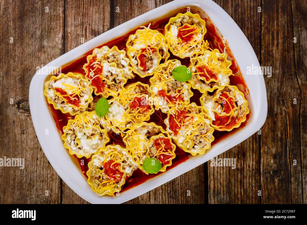 Stuffed rolls made from pasta, meat and ricotta cheese with tomato ...