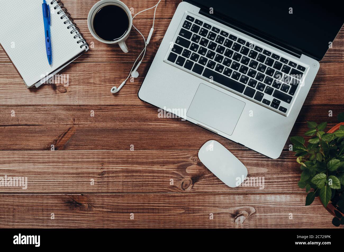 office stuff with notepad, laptop and coffee cup mouse notepad top view ...