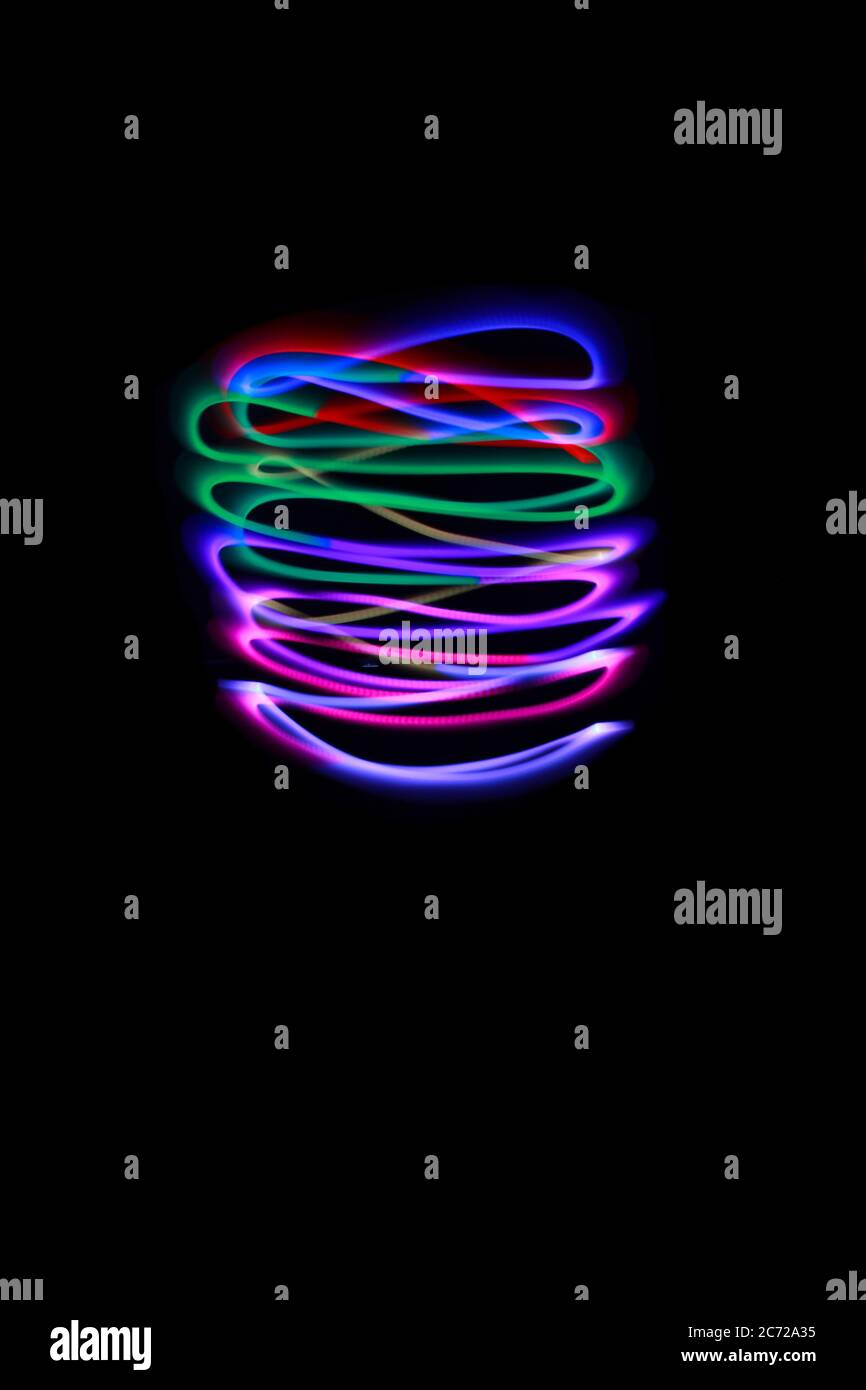 Curved abstract shape made with a light saber violet. Lightpainting ...