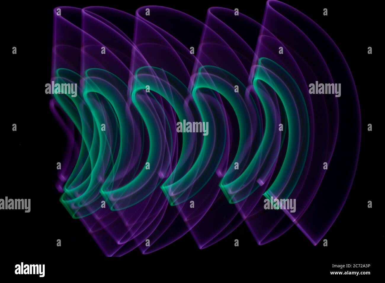 Curved abstract shape made with a light saber. Lightpainting session at ...