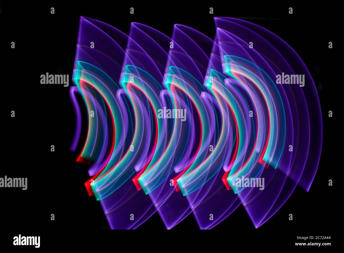 Curved abstract shape made with a light saber violet. Lightpainting ...