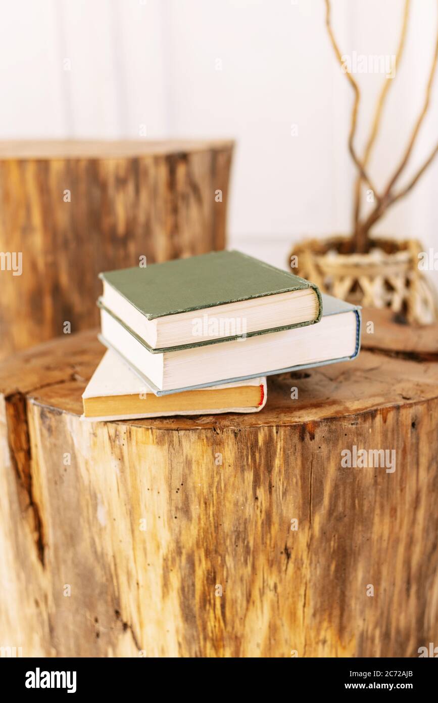Book on a bedside table made of wood Stock Photo - Alamy