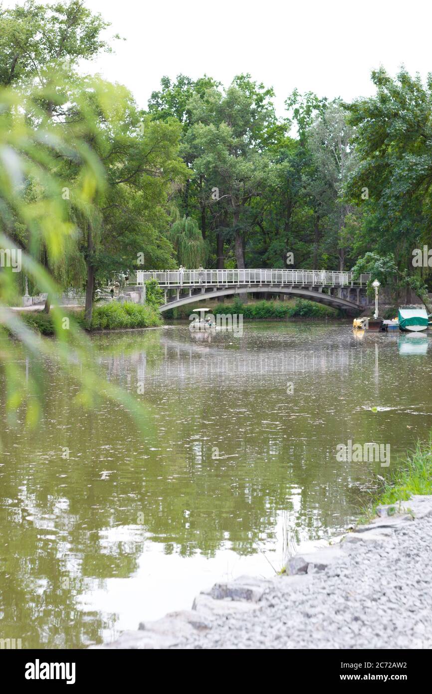Beautiful bridge on the river - spring photo, blur Stock Photo - Alamy