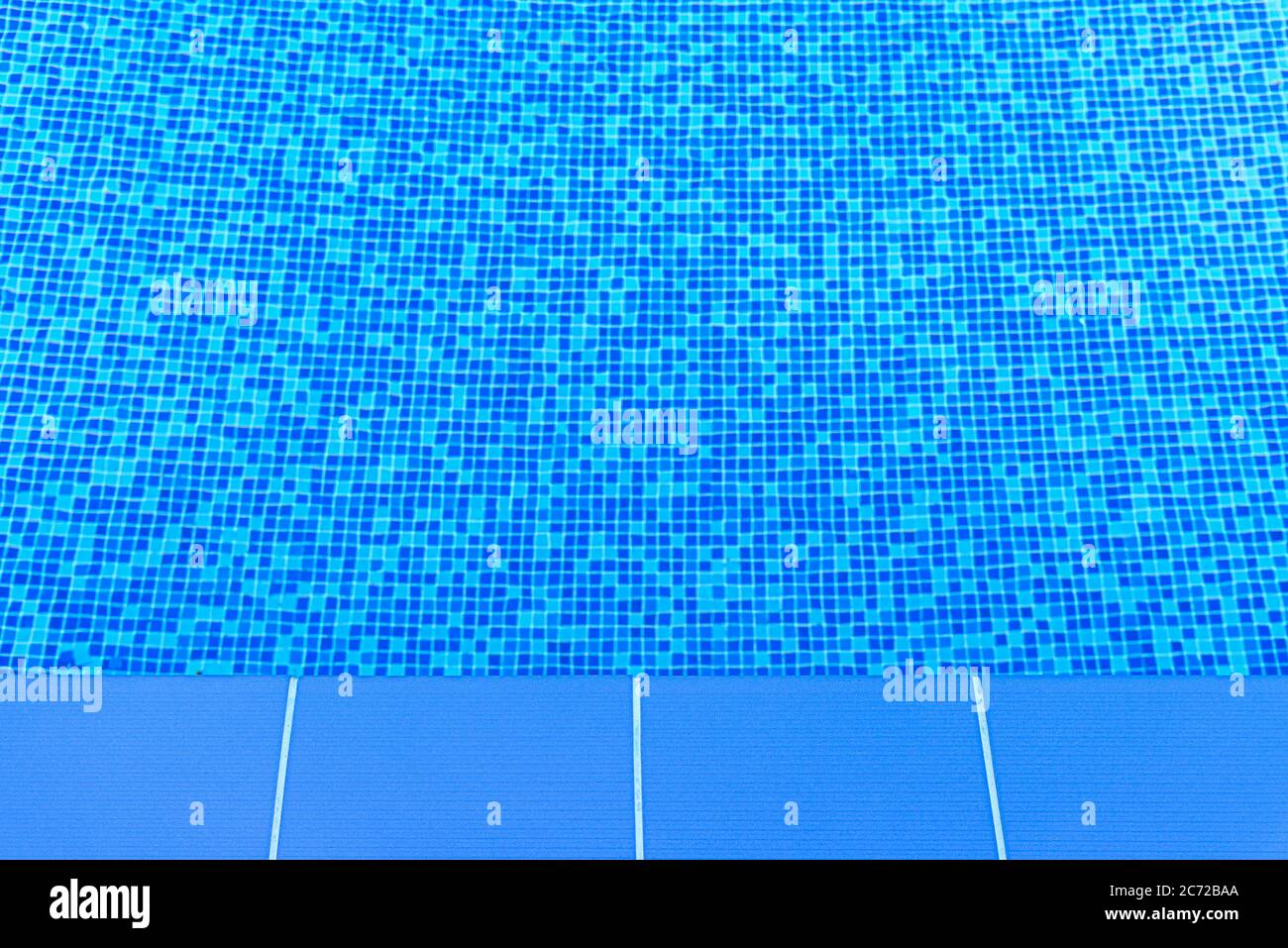 Beautiful swimming pool with blue tiles closeup Stock Photo - Alamy