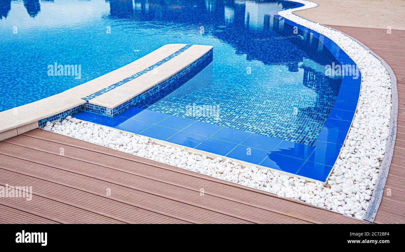 Beautiful swimming pool with blue tiles closeup Stock Photo - Alamy