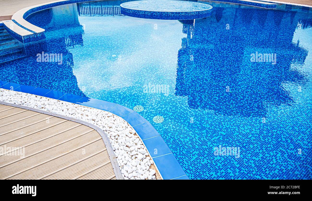 Beautiful swimming pool with blue tiles closeup Stock Photo - Alamy