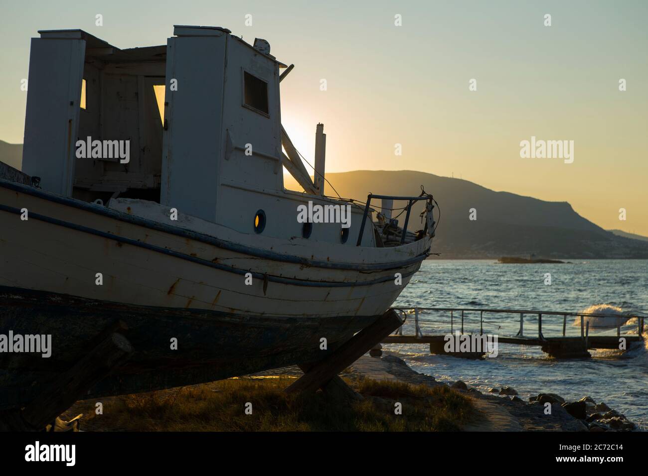 Old boat on a sea shore Stock Photo - Alamy