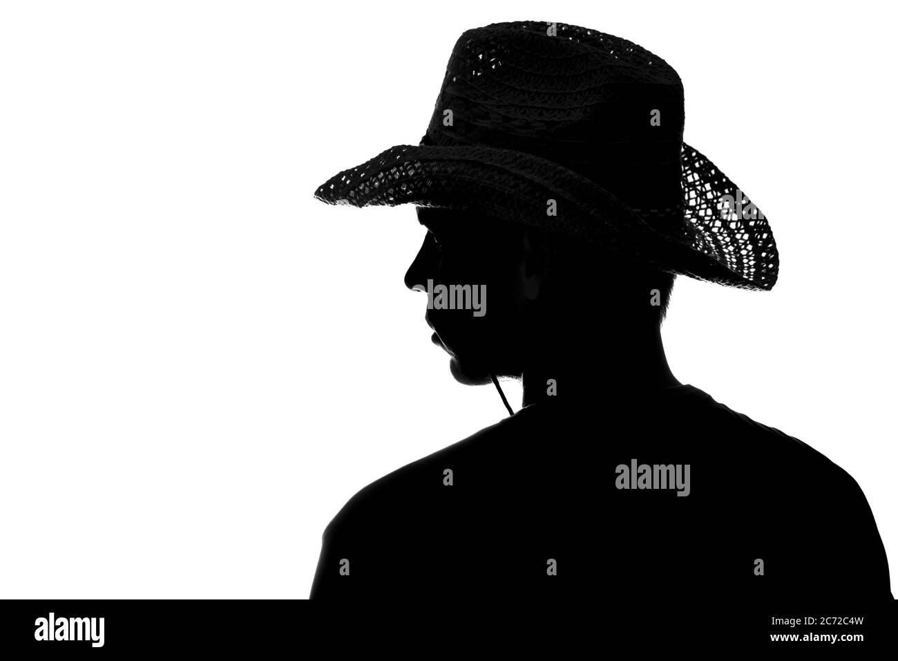 young man in a straw hat silhouette - side view Stock Photo - Alamy