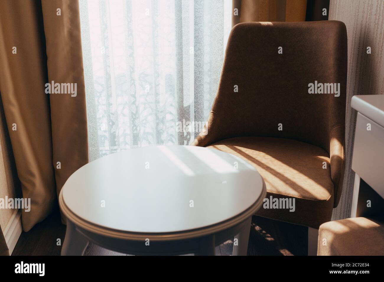 table with a chair by the window on a sunny day. modern interior Stock ...