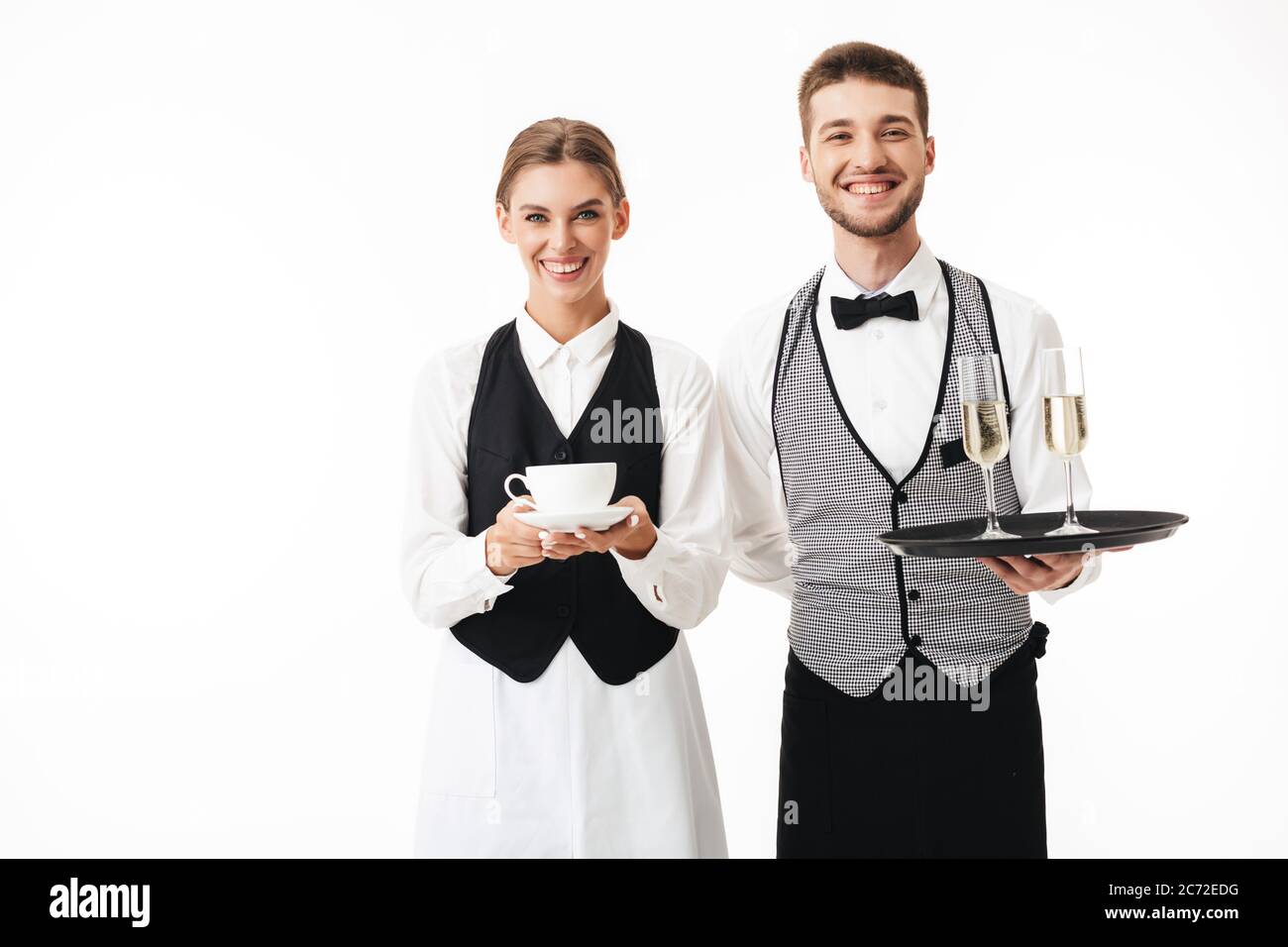 Professional male waiter in uniform serving champagne hi-res stock ...