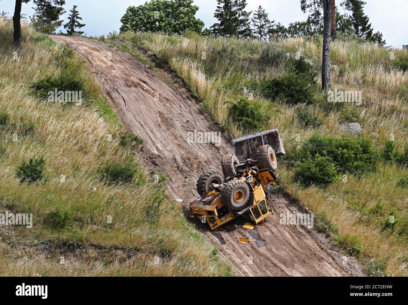 Motala, Sweden 20200713 A wheel loader rolled down a slope and turned ...