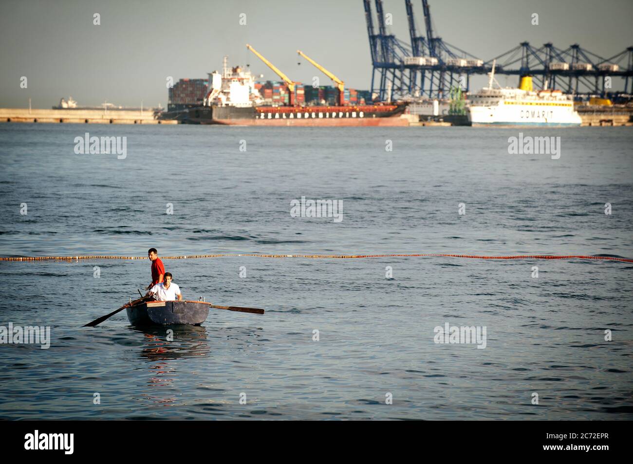 Fishermen of the Fernandez y Moreno fishing boat sail on a row vessel ...