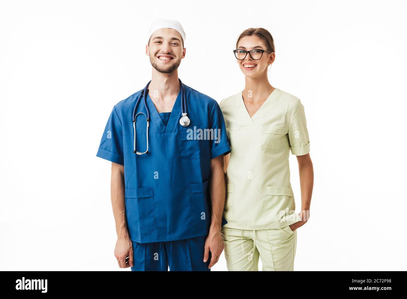 Young smiling doctor with phonendoscope on neck and pretty nurse in ...