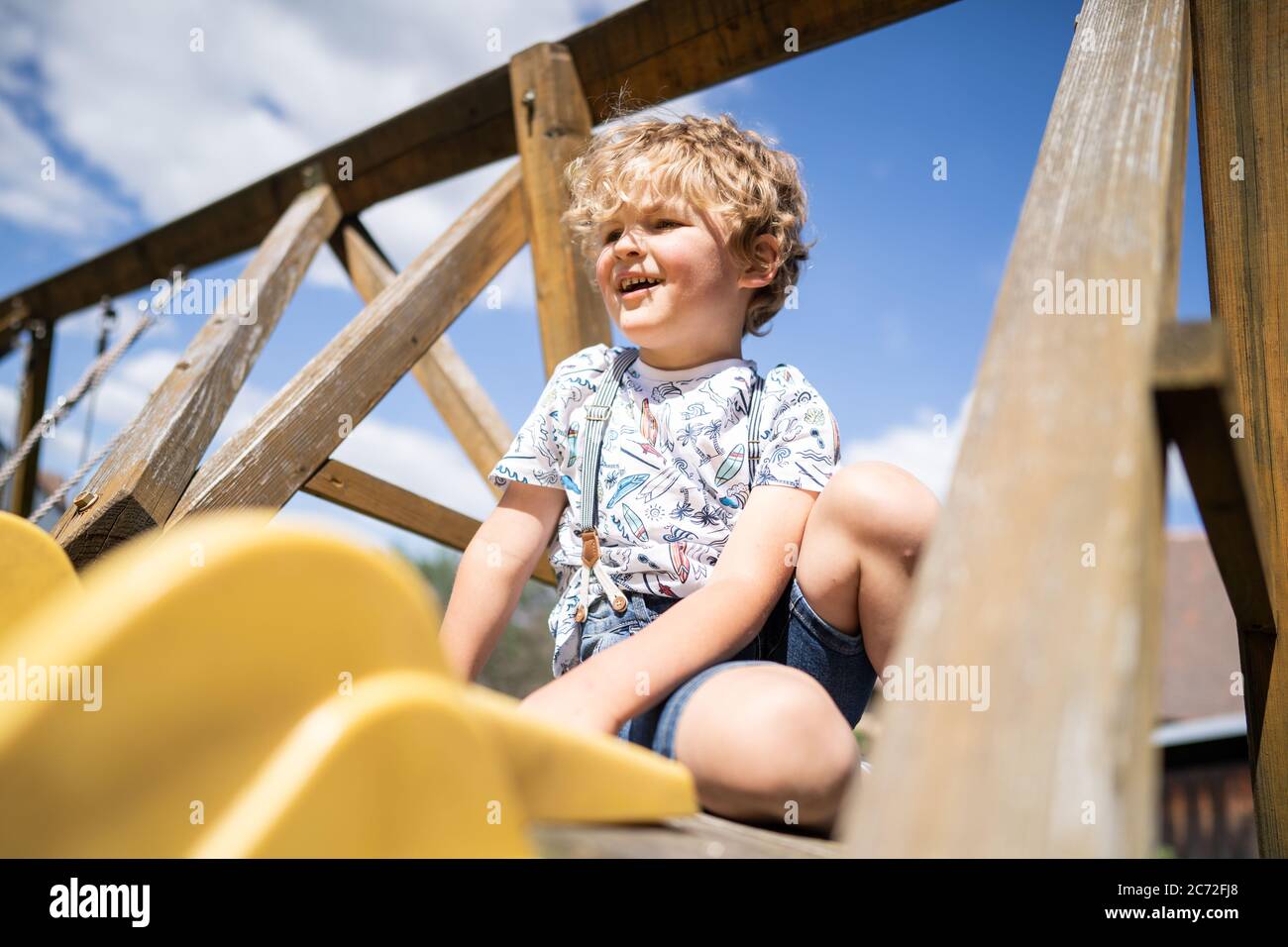 Little boy playing on playground Stock Photo - Alamy