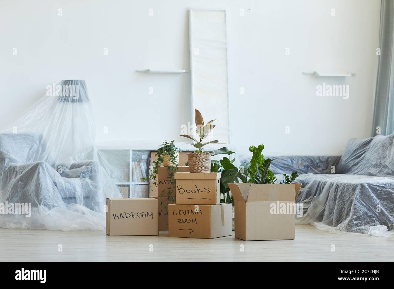 Image of signed boxes with things o the floor in new house Stock Photo ...
