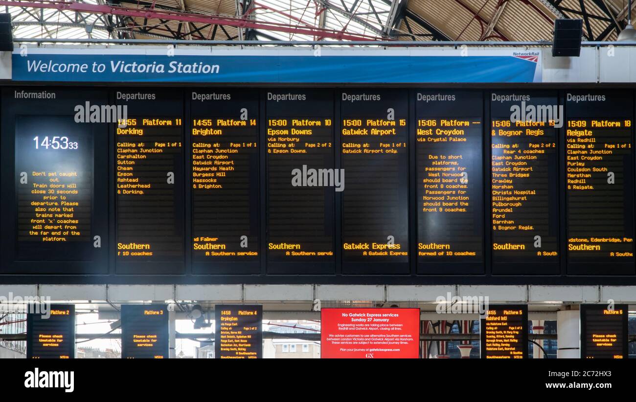London, United Kingdom - January 2019: Timetable listing the many train ...
