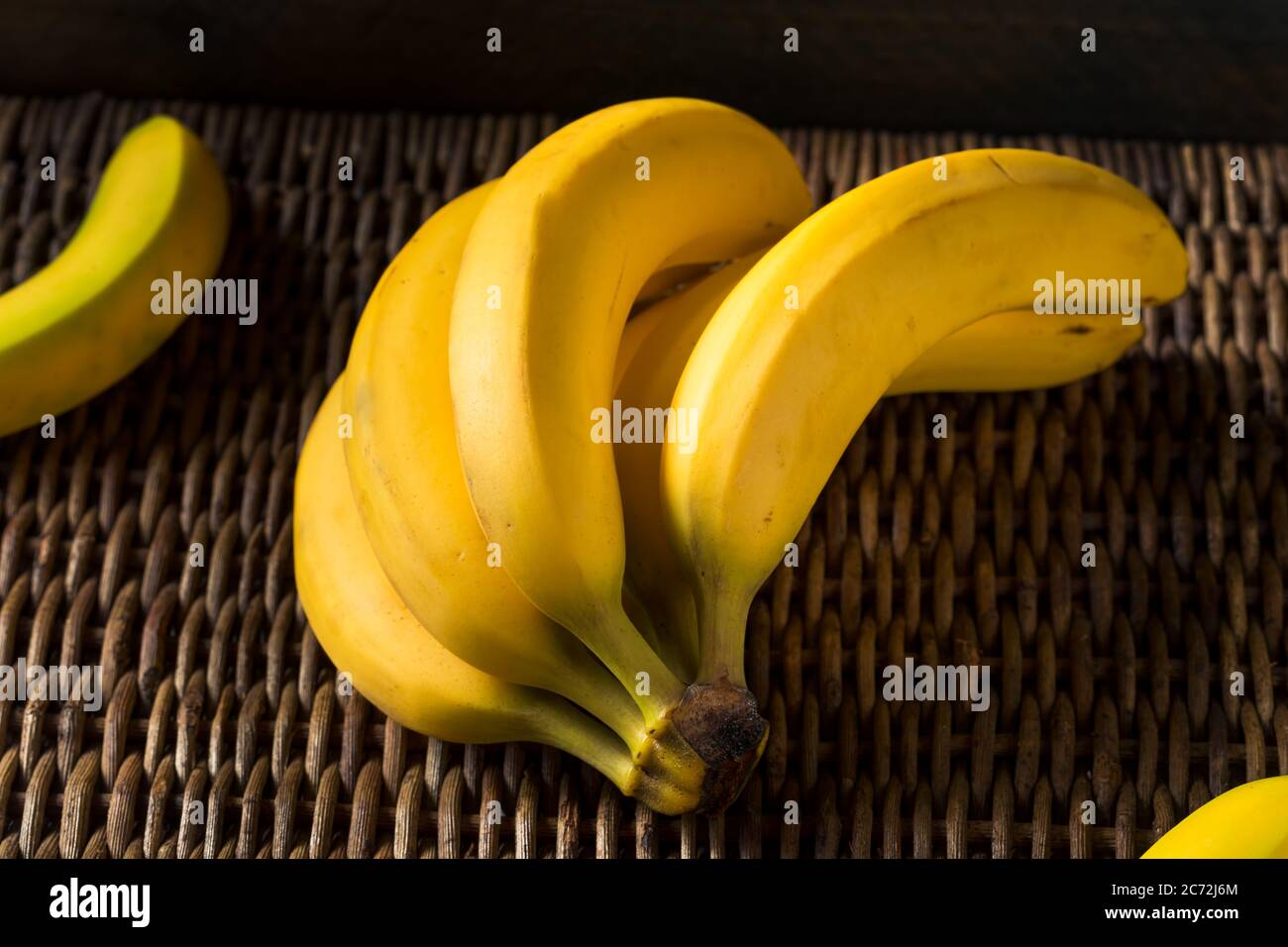 Raw Yellow Organic Bananas in a Bunch Stock Photo - Alamy