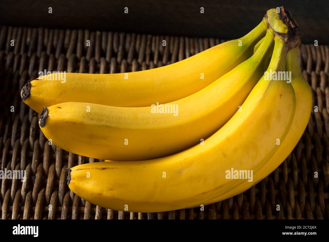 Raw Yellow Organic Bananas in a Bunch Stock Photo - Alamy