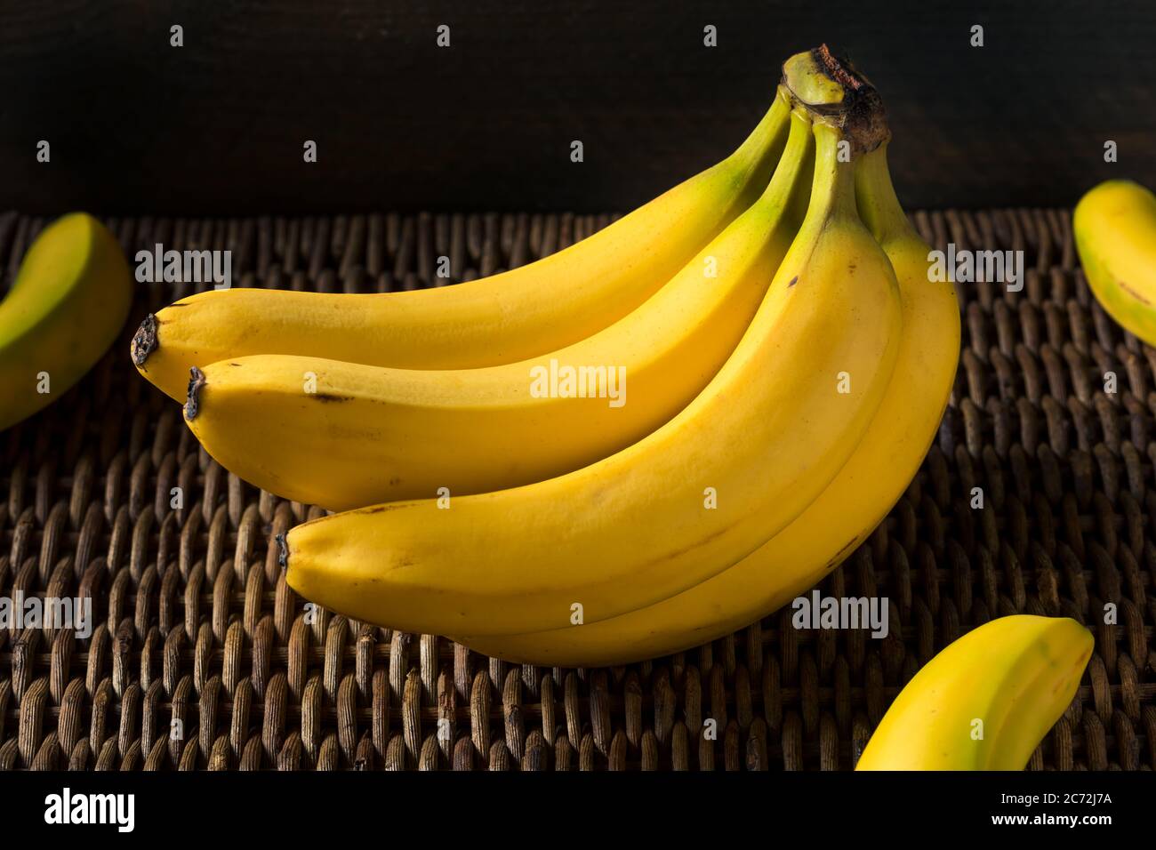 Raw Yellow Organic Bananas in a Bunch Stock Photo - Alamy
