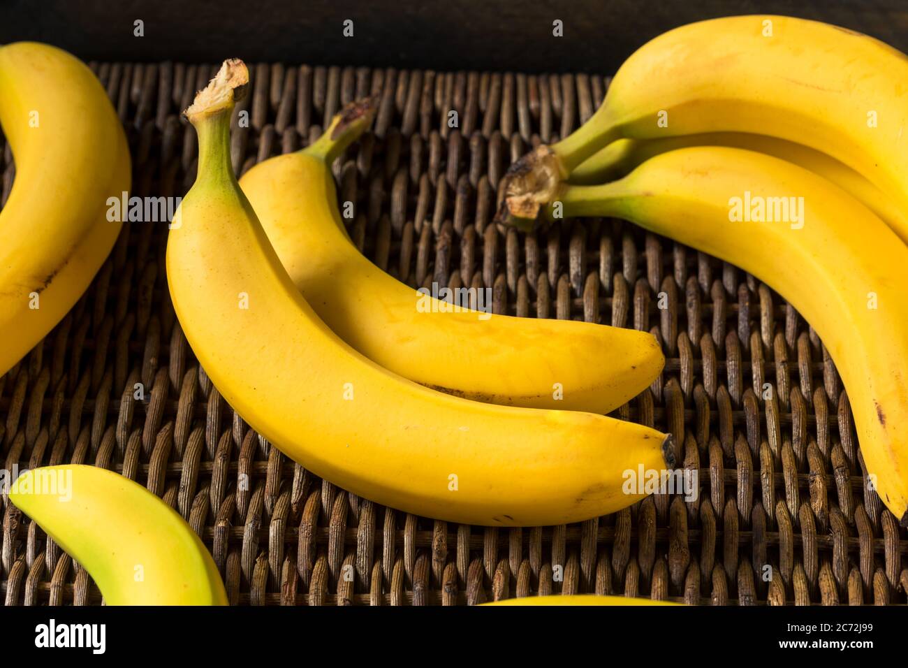 Raw Yellow Organic Bananas in a Bunch Stock Photo - Alamy