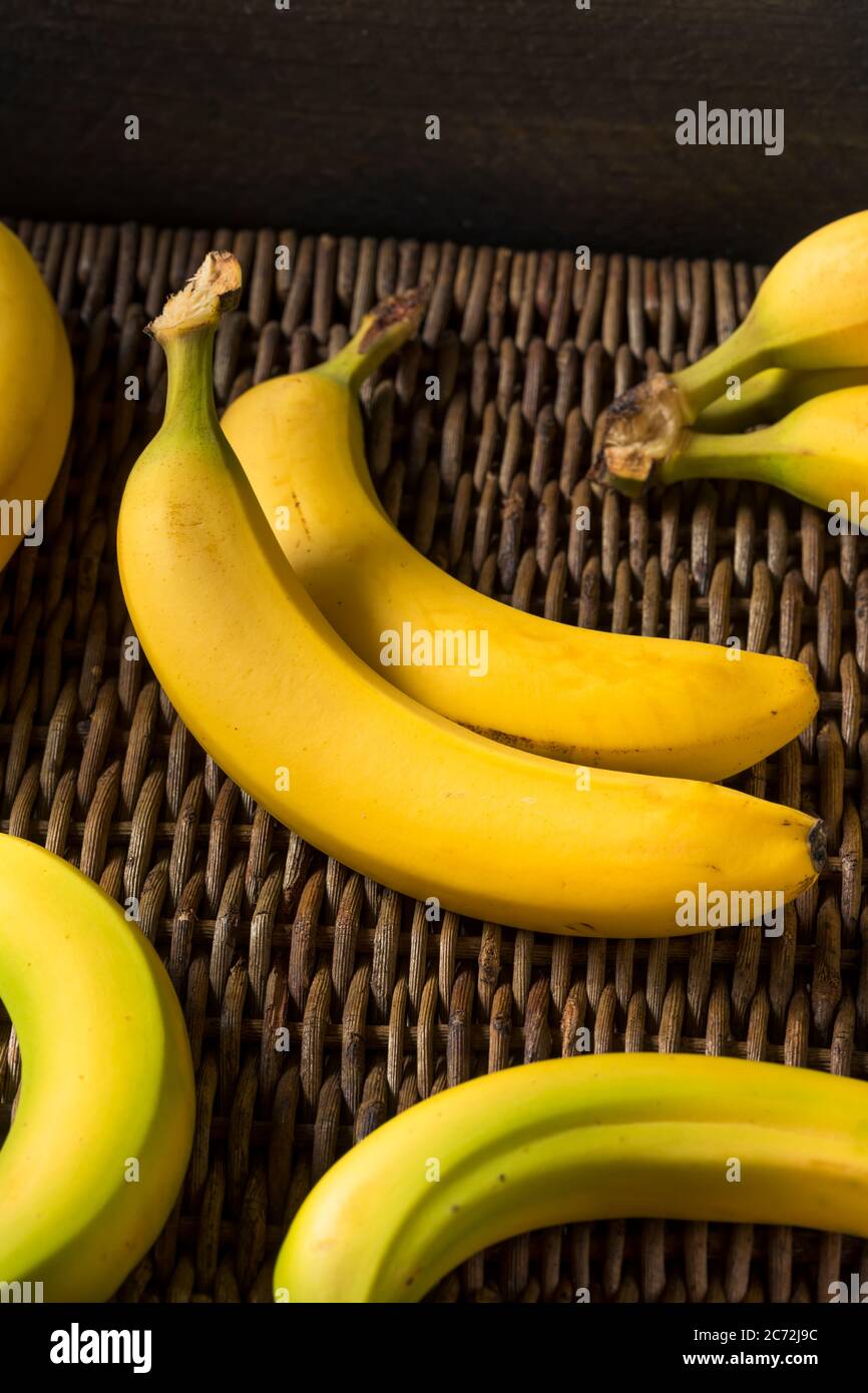 Raw Yellow Organic Bananas in a Bunch Stock Photo - Alamy