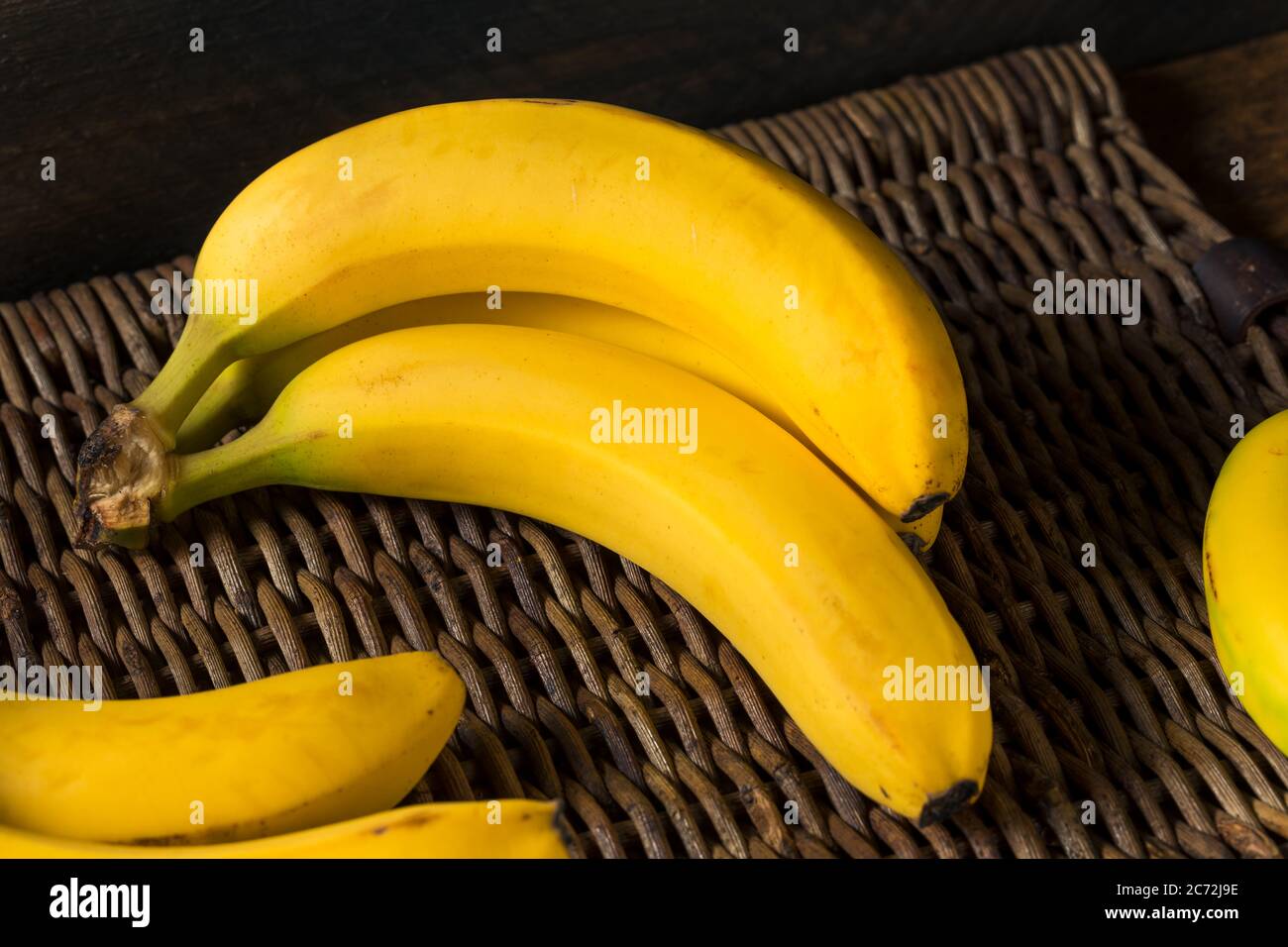 Raw Yellow Organic Bananas in a Bunch Stock Photo - Alamy