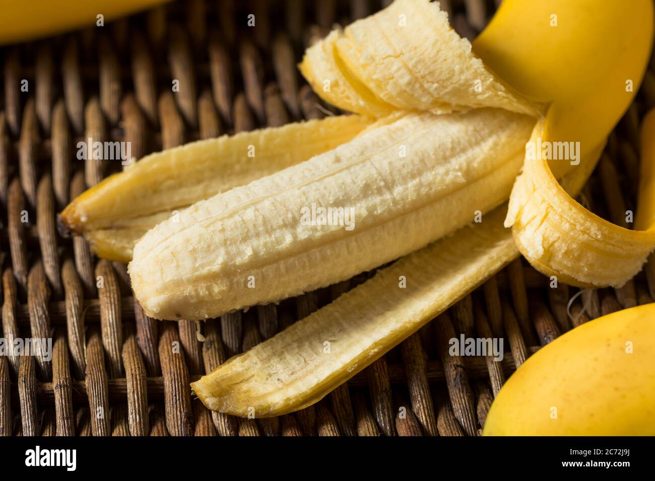 Raw Yellow Organic Bananas in a Bunch Stock Photo - Alamy
