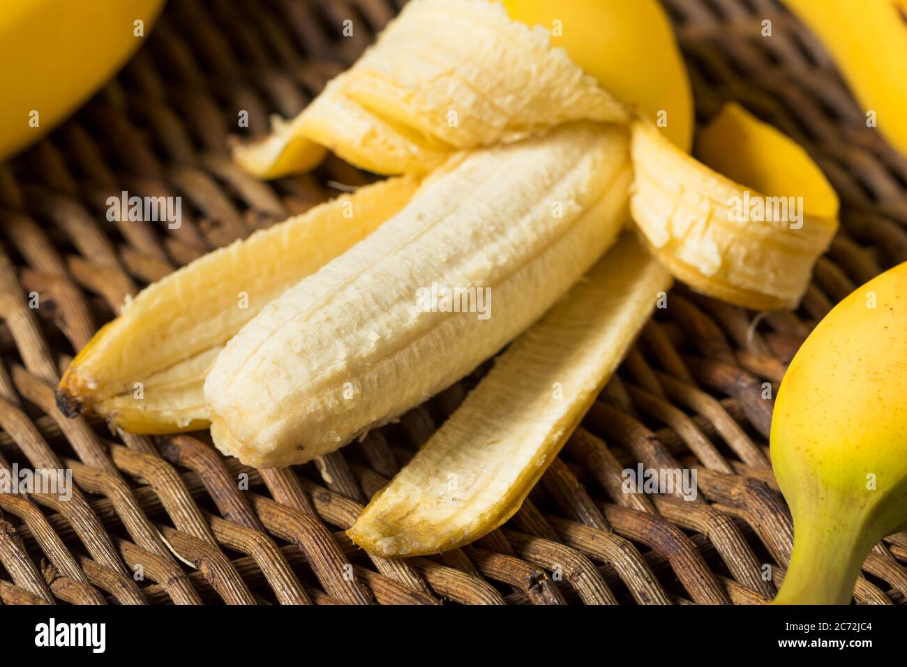 Raw Yellow Organic Bananas in a Bunch Stock Photo - Alamy