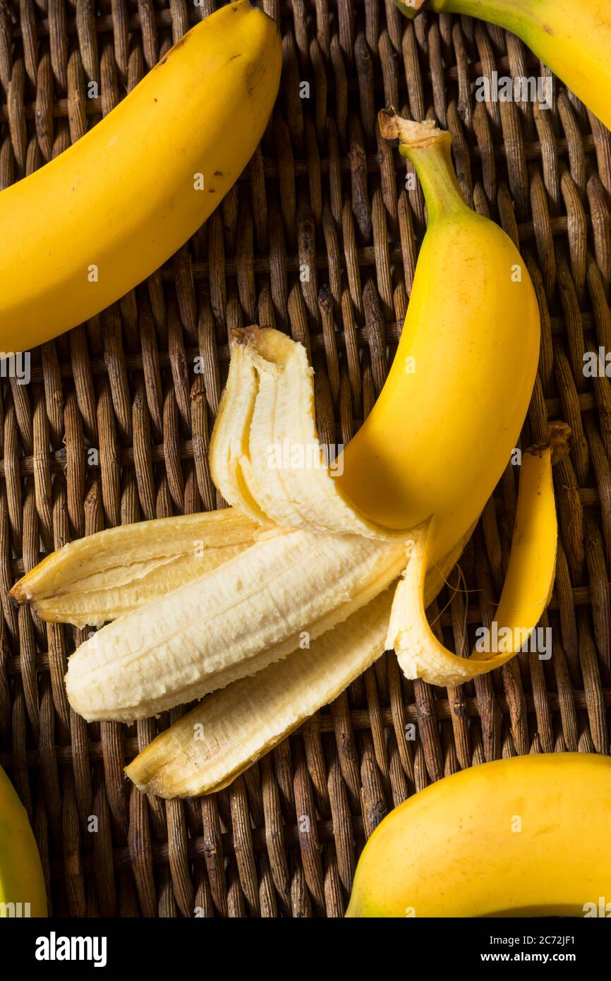 Raw Yellow Organic Bananas in a Bunch Stock Photo - Alamy