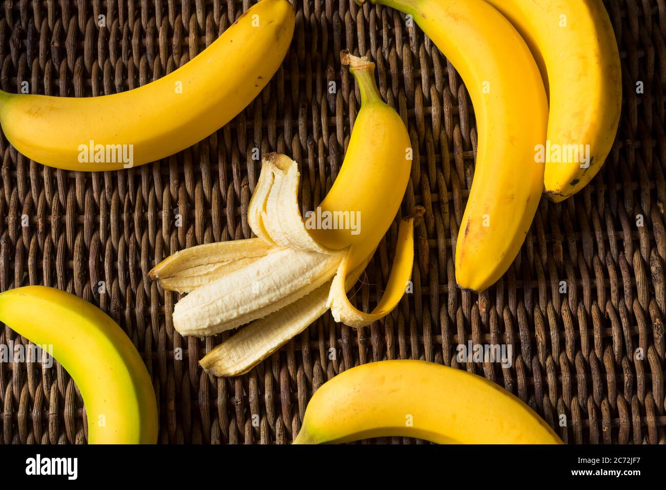 Raw Yellow Organic Bananas in a Bunch Stock Photo - Alamy