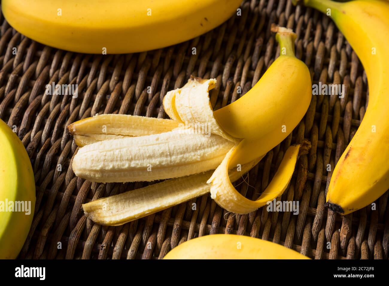 Raw Yellow Organic Bananas in a Bunch Stock Photo - Alamy