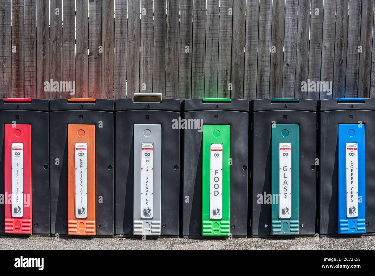 Recycling bins. Common colour coding is blue for paper, grey or black ...