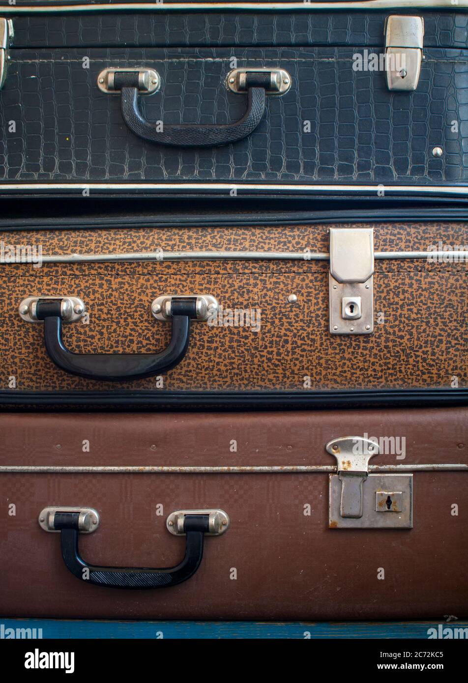 Three old suitcases on top of each other. Close up Stock Photo - Alamy