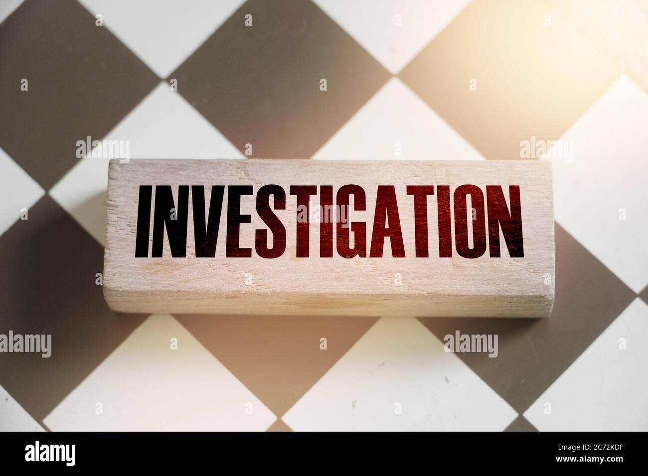 Investigation word on wood block on chessboard. Research business ...