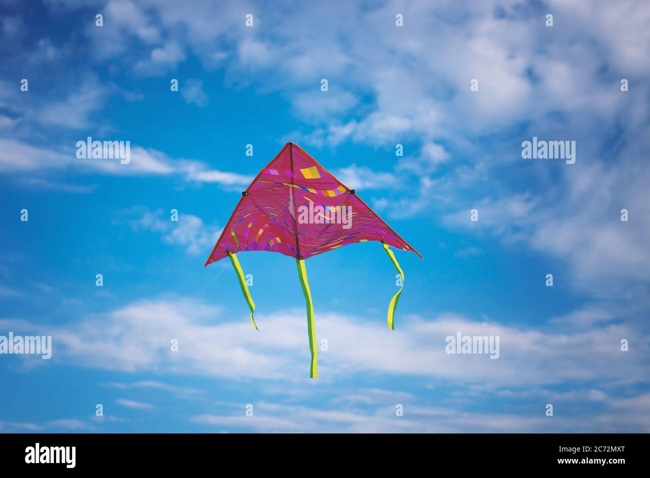 Flying white kite in blue sky with clouds hi-res stock photography and ...