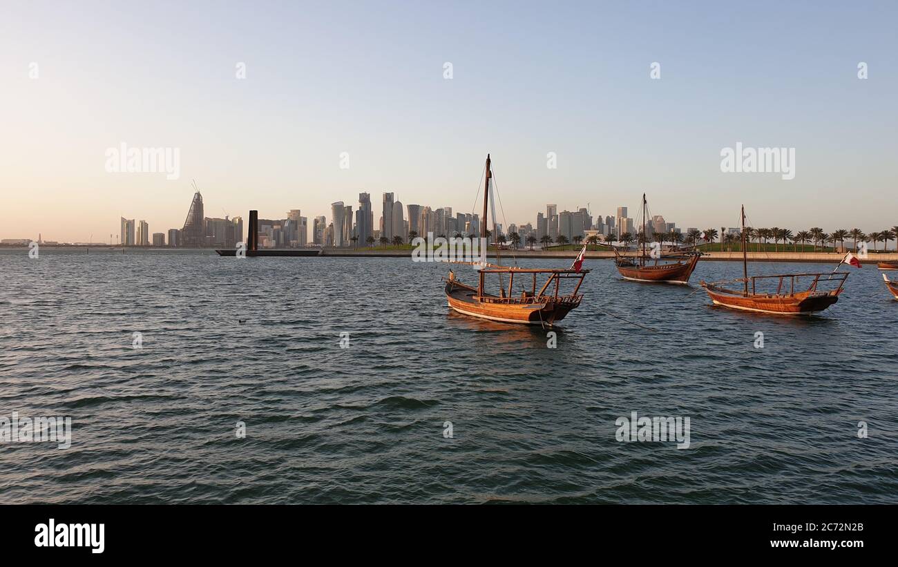 Doha, Qatar - February 2019: Doha Qatar skyline with traditional Qatari ...
