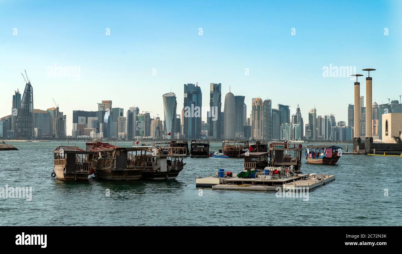 Doha, Qatar - February 2019: Doha Qatar skyline with traditional Qatari ...