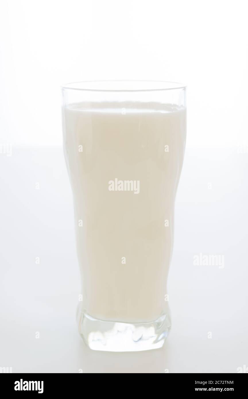 Glass of milk on a white background. Photo of milk in high key ...