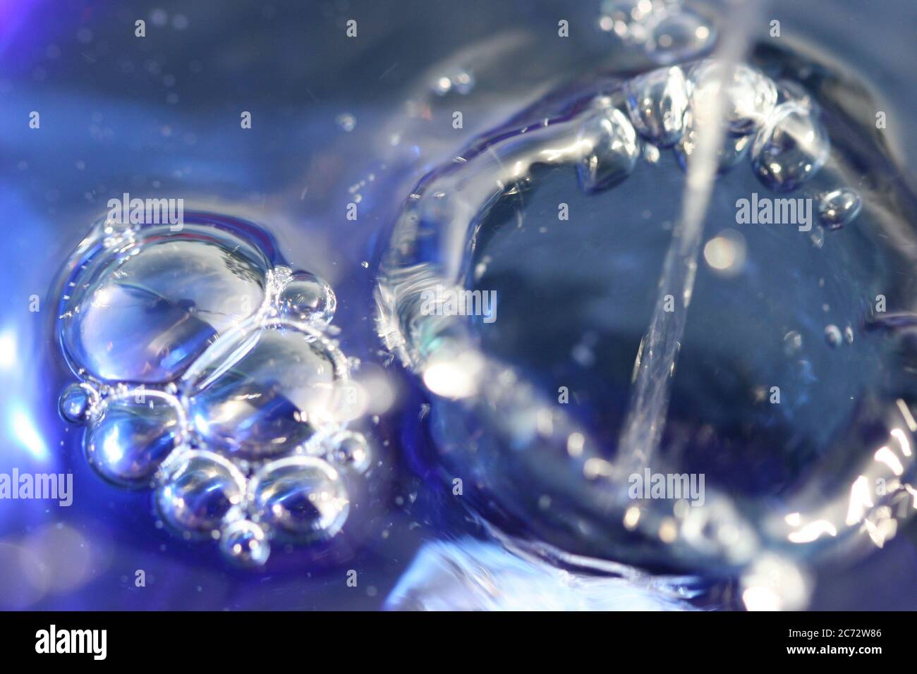 Water drops in deep blue water with ring designs and ripples Stock ...